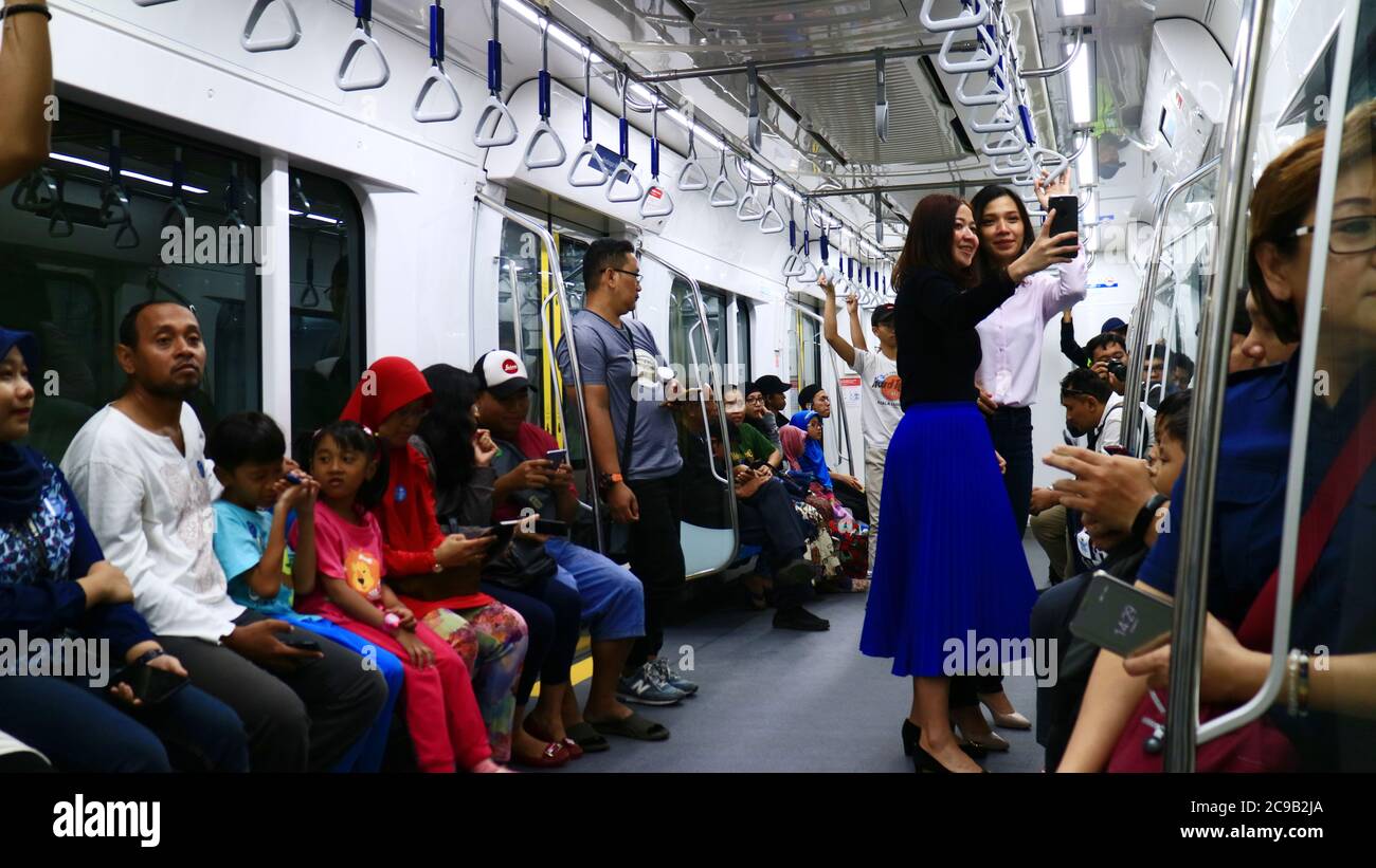 Jakarta, Indonesia - March 15, 2019: Passengers take pictures in the ...