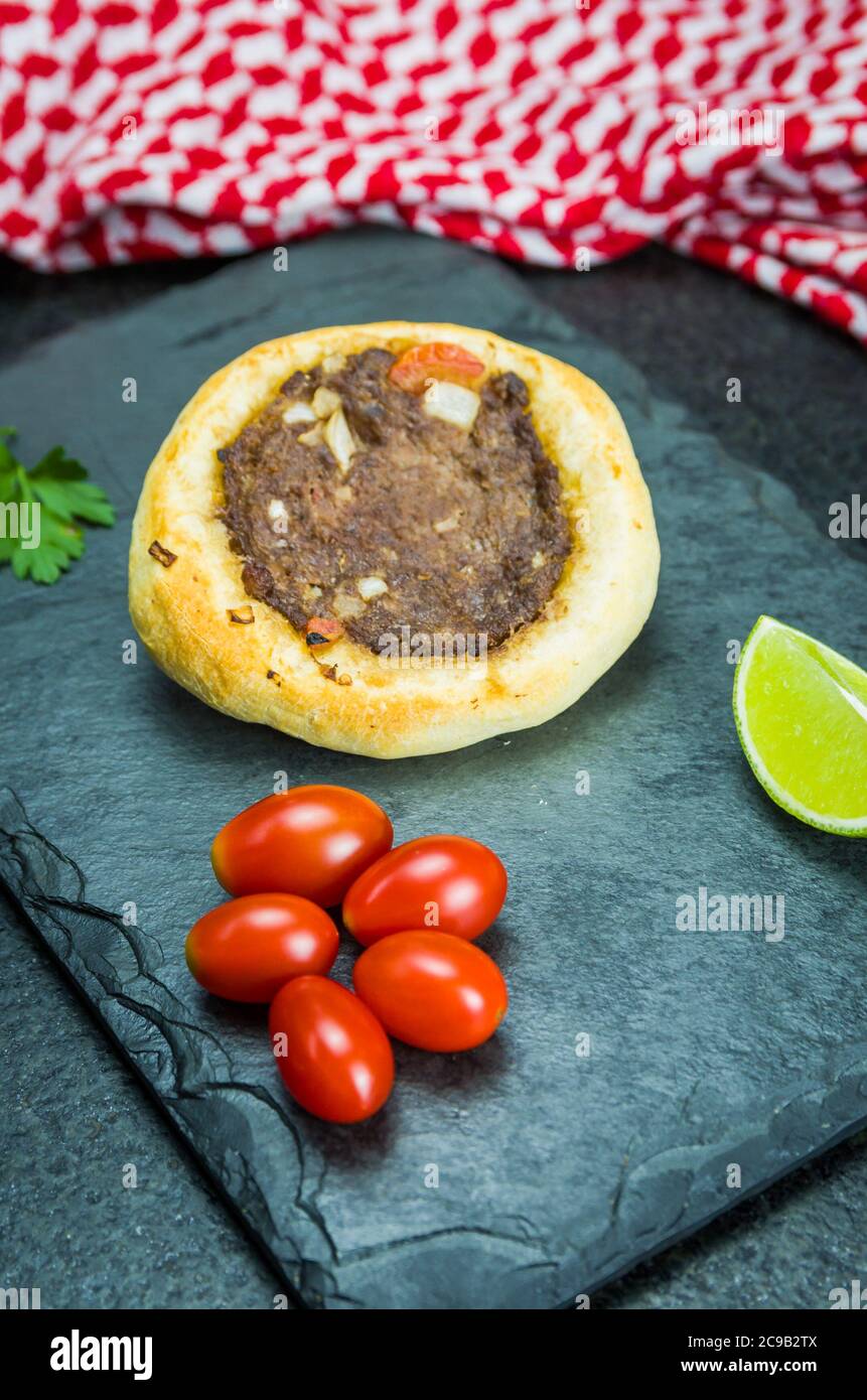 Delicious Lebanese (Arabic) food, legitimate sfihas on a black granite ...