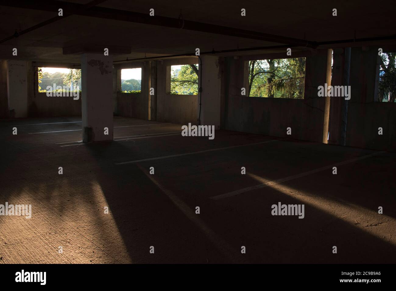 Empty parking garage Stock Photo - Alamy