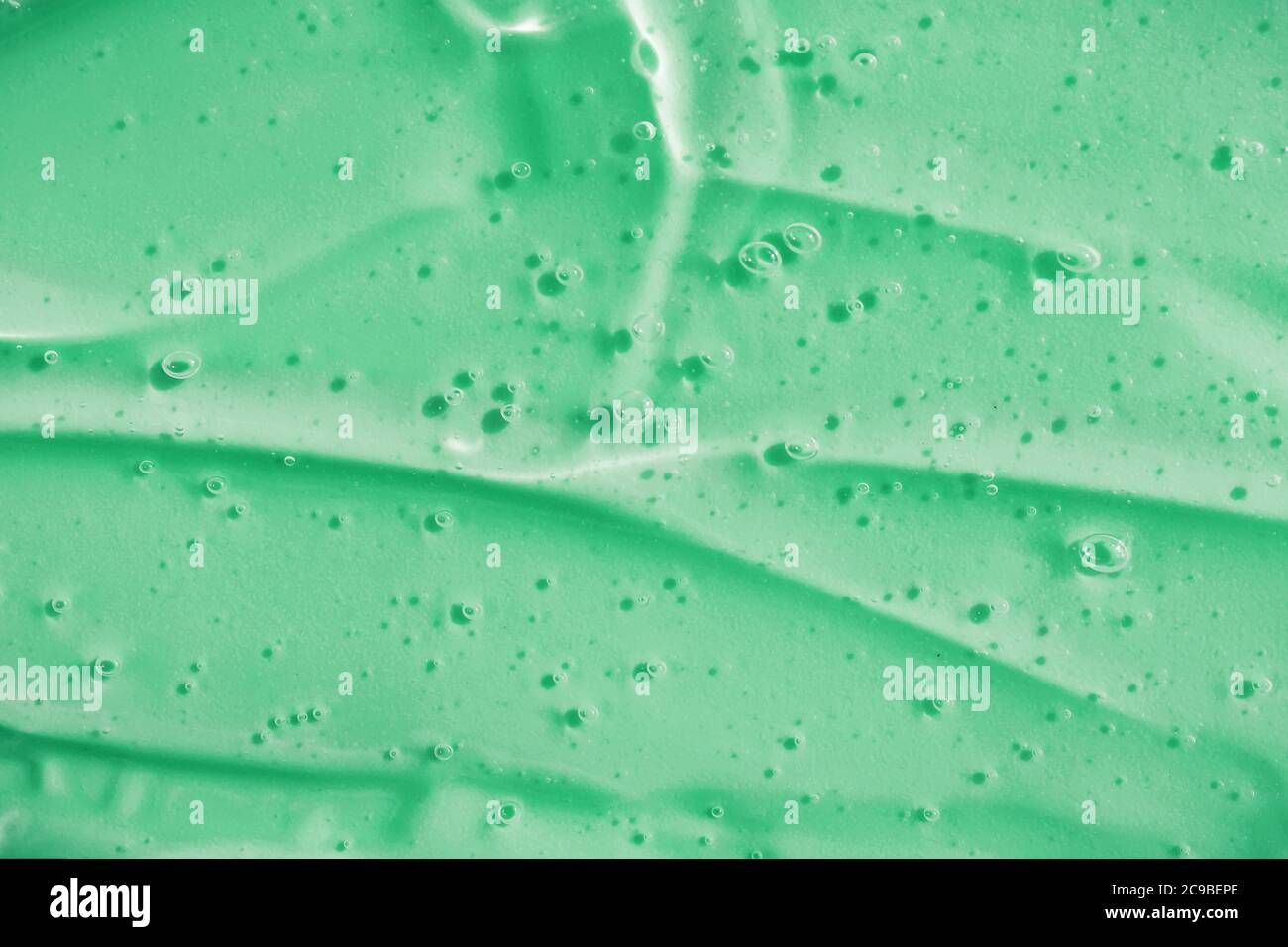 Mint color gel with bubbles texture Stock Photo - Alamy