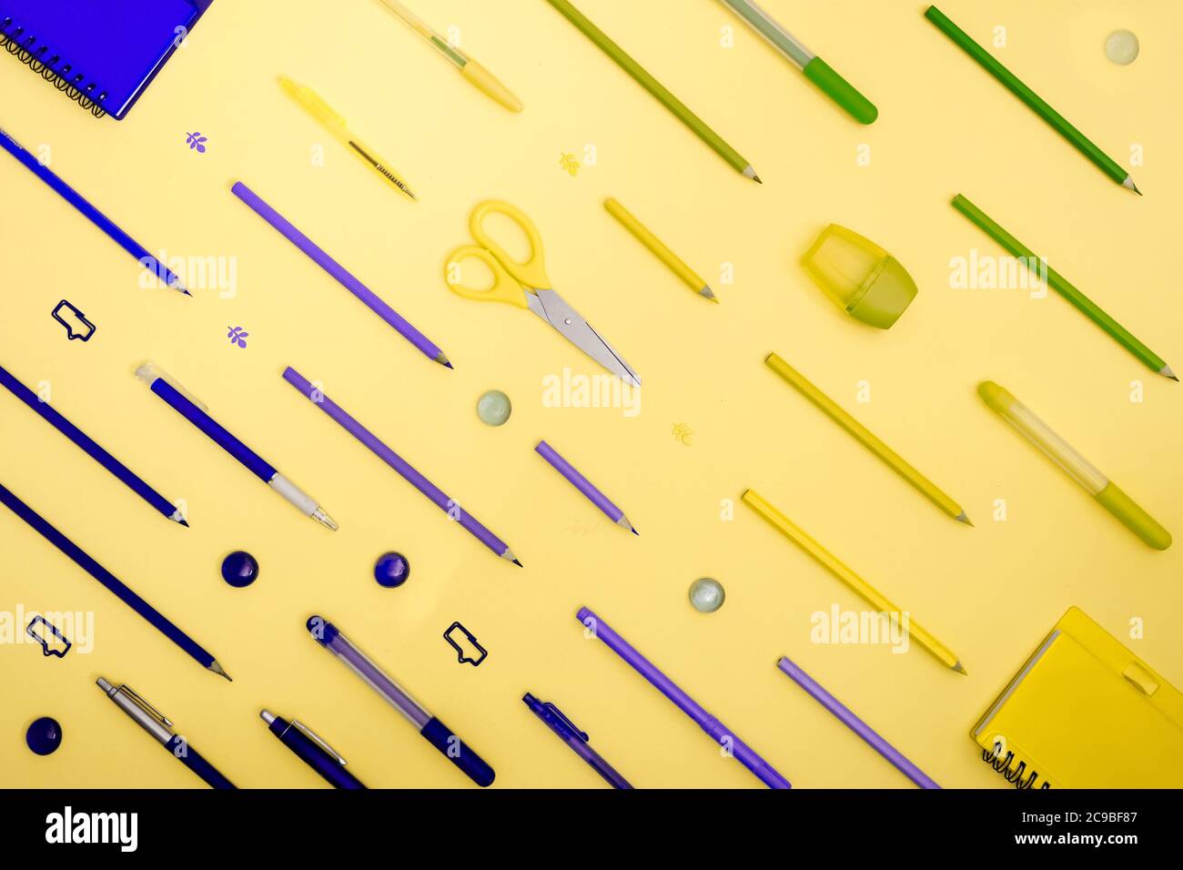 Stationery on yellow. Flat lay. Rows of tools, gradient colors from ...