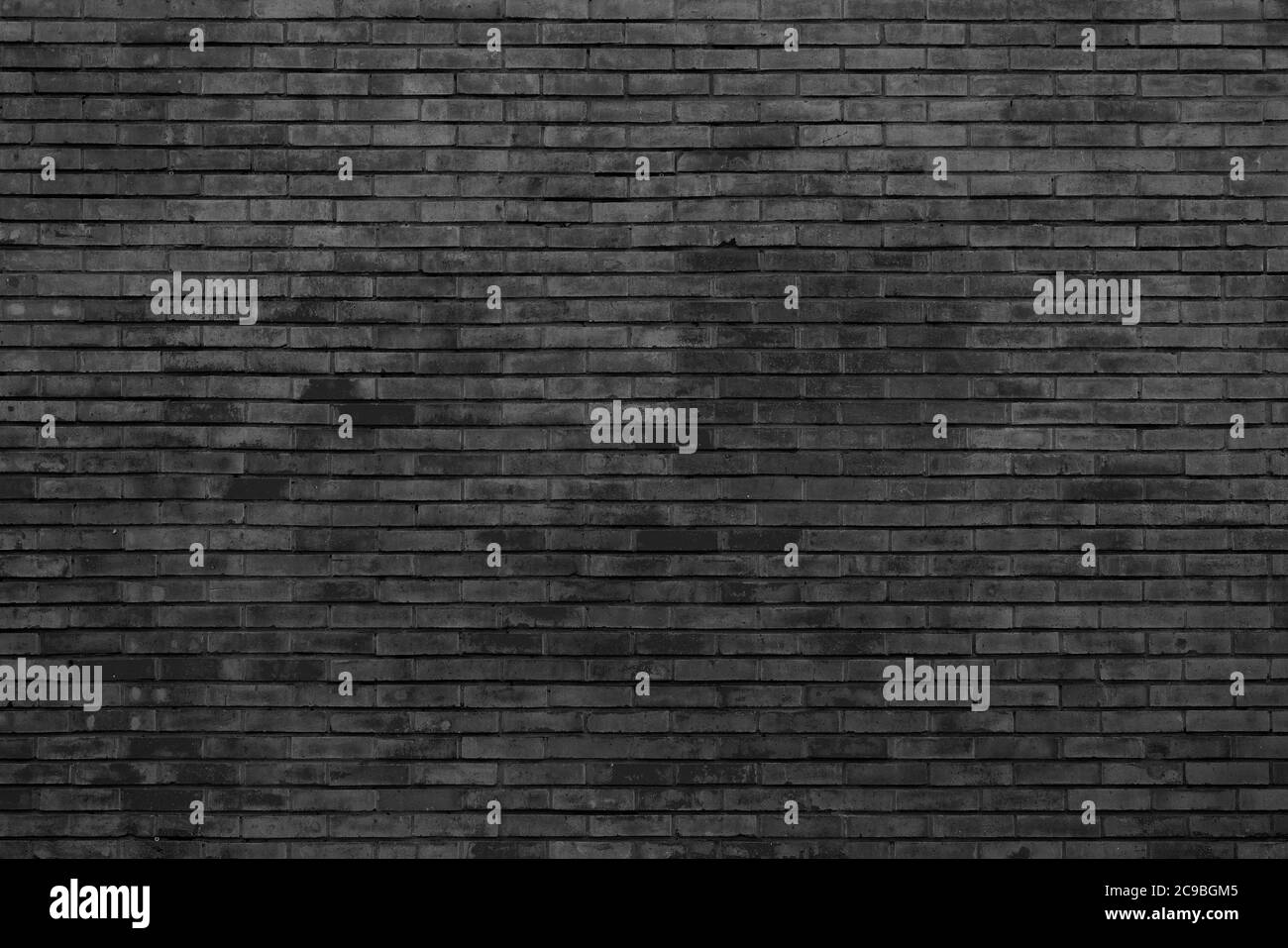 The background of the old black brick wall for design interior and ...