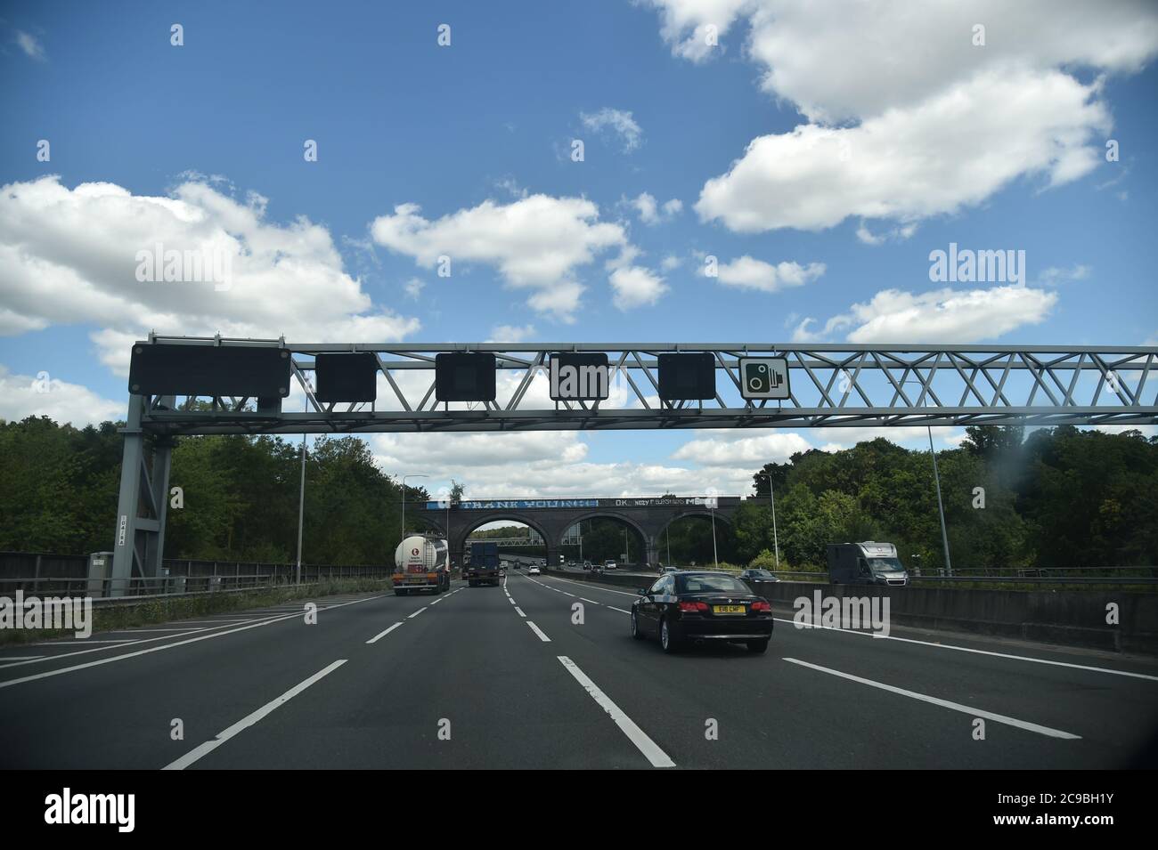 Motorway traffic and signage gantry Stock Photo - Alamy