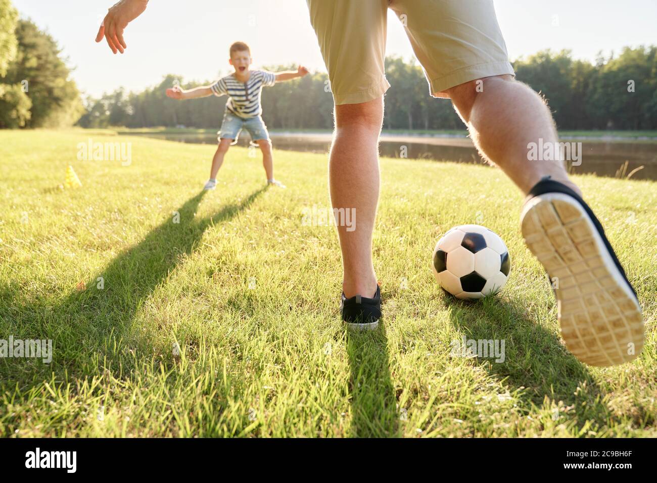 Two boys playing football in the garden Stock Photo - Alamy
