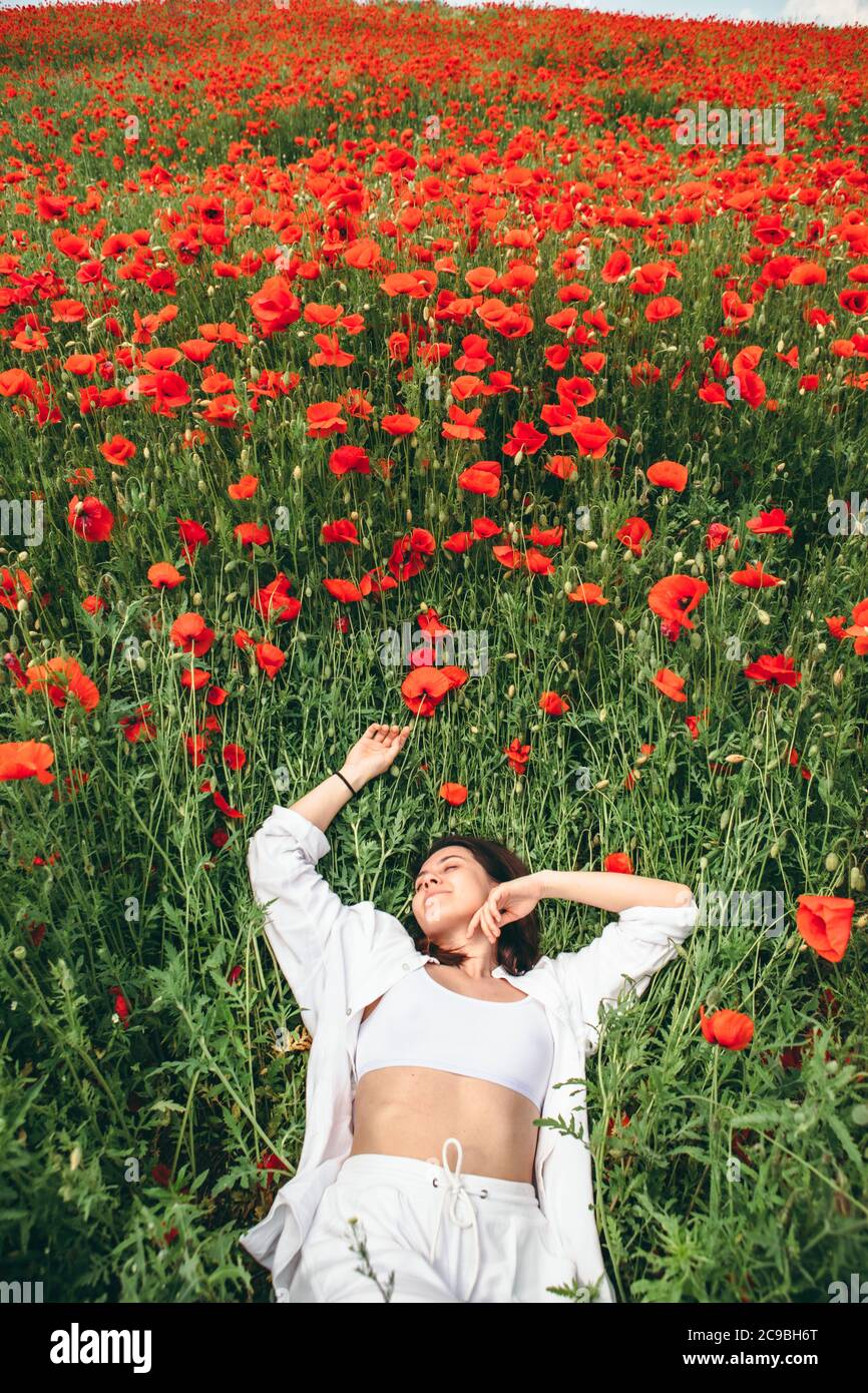Girl Laying In Flowers
