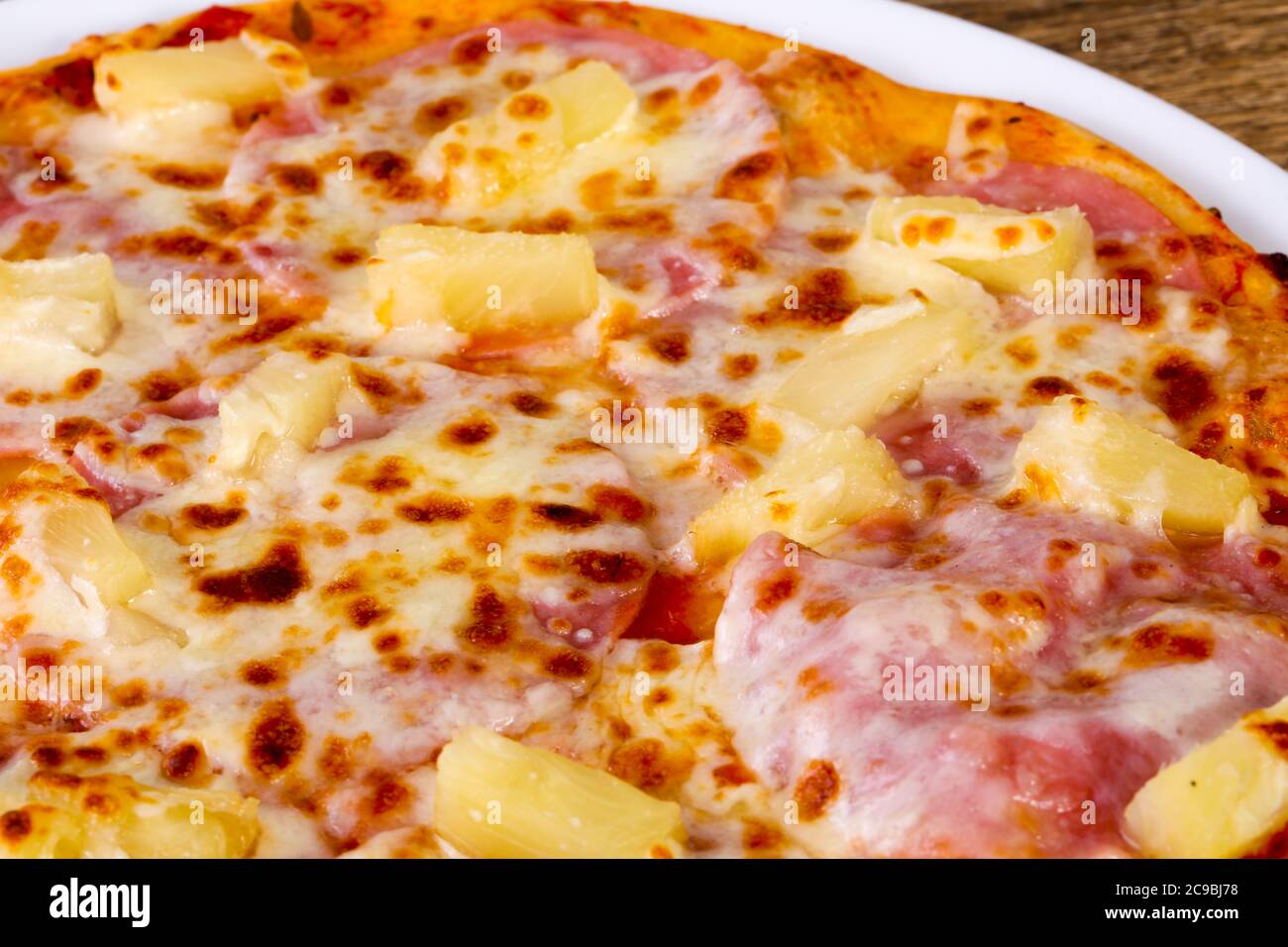 Pizza with ham and cheese Stock Photo - Alamy