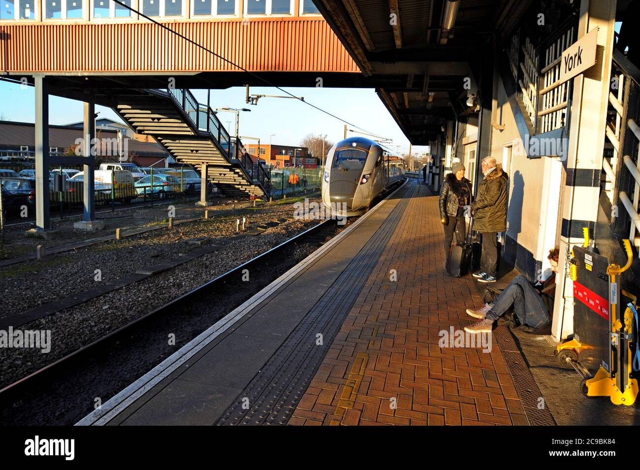 An LNER Azuma high speed electric train approaches the platform at York ...