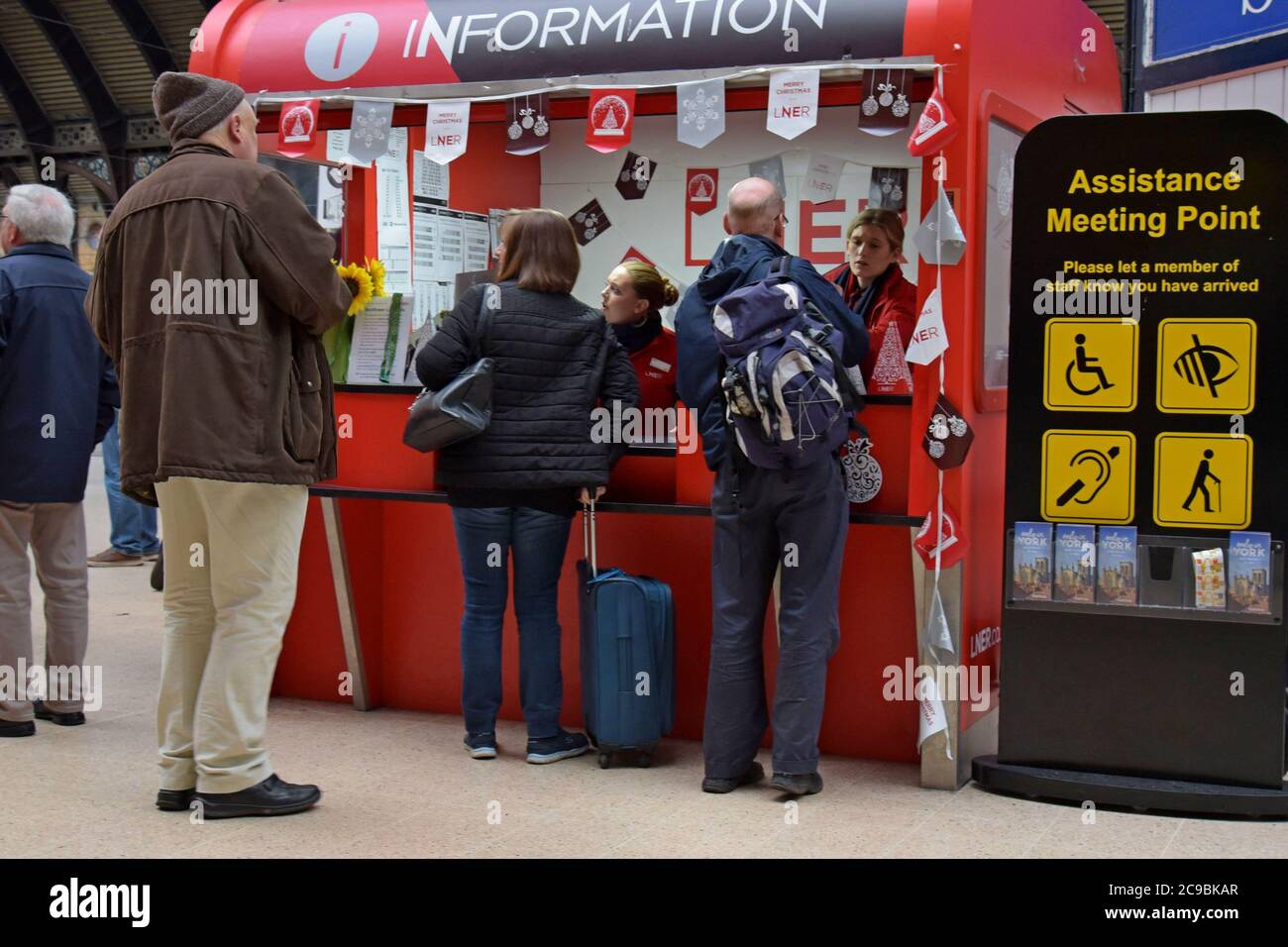 LNER Railway staff helping passengers at York Railway Station Stock ...