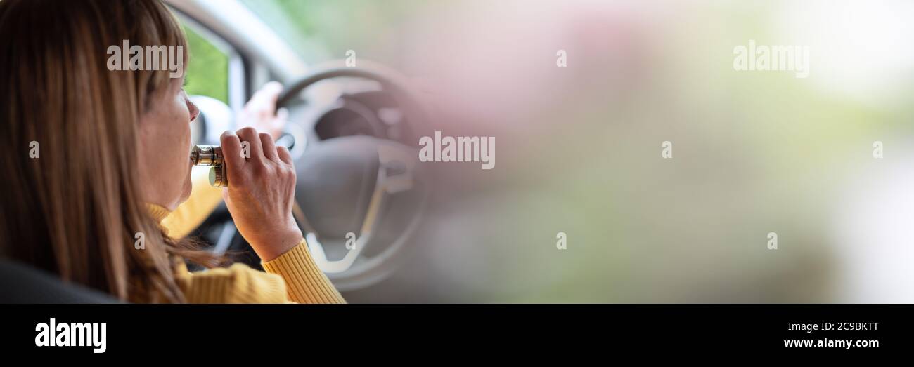 Woman smoking cigarette driving hi-res stock photography and images - Alamy