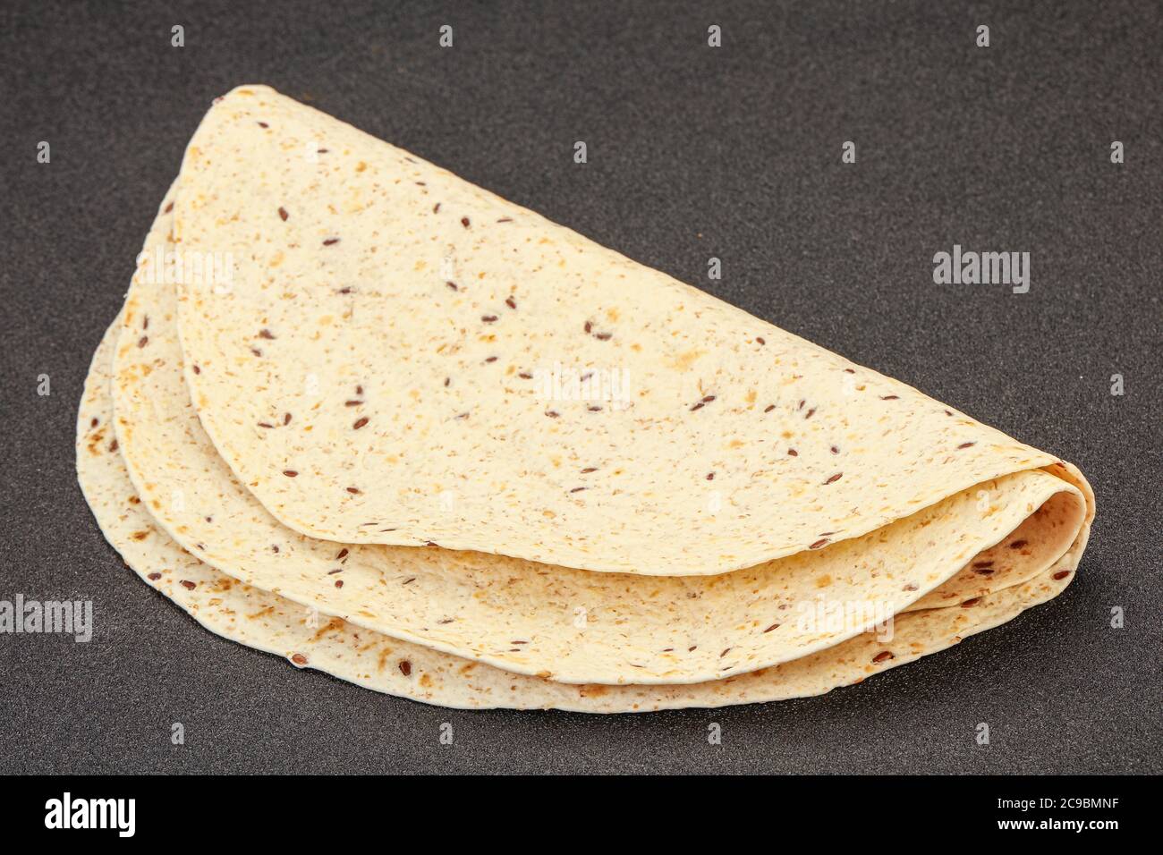 Mexican cuisine - Tortilla thick bread with cereal Stock Photo - Alamy