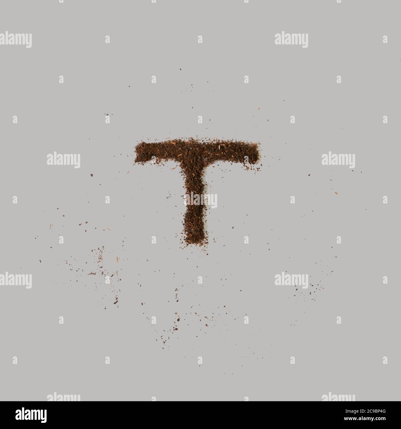 The letter T written in tea leaves Stock Photo - Alamy