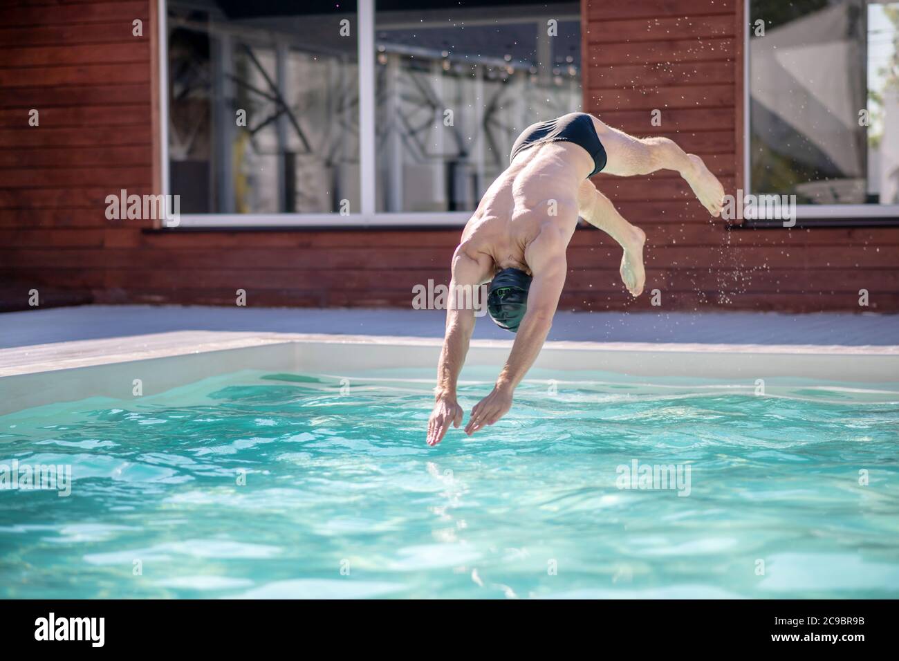 Swimmer at the time of jump in open pool Stock Photo - Alamy