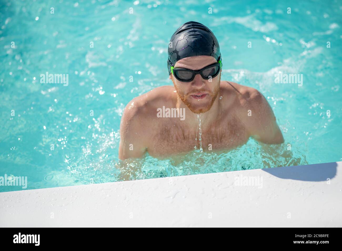 Man swimming in the water in the pool Stock Photo - Alamy