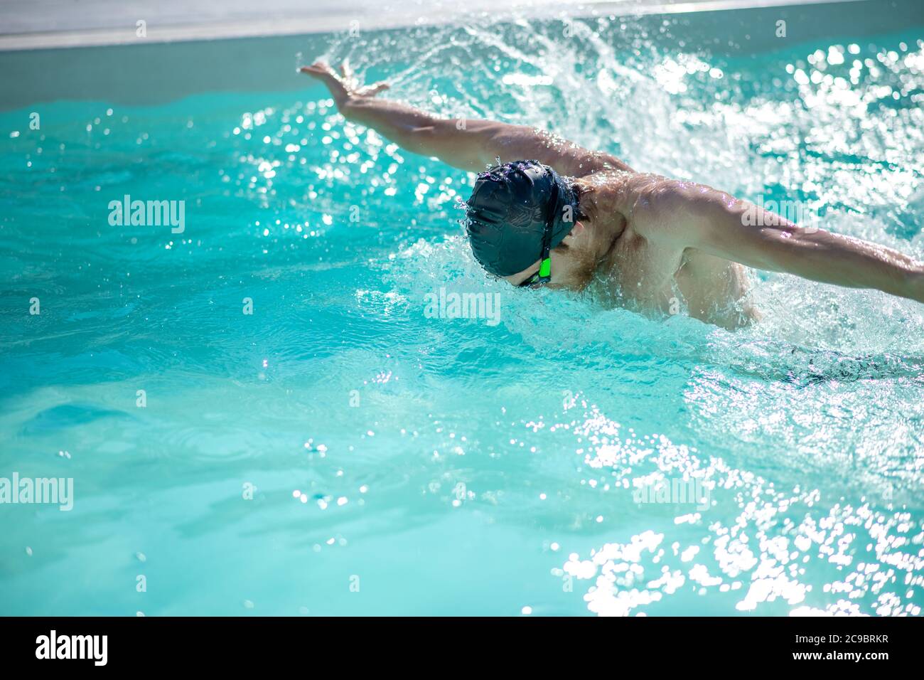 Swimmer during a swim in swimming pool Stock Photo - Alamy
