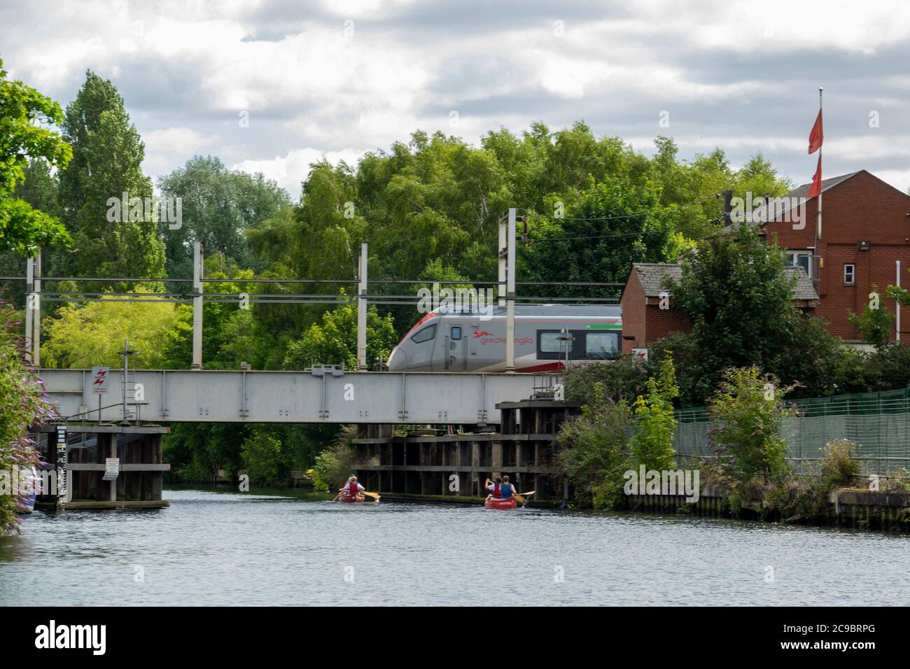 Trowse railway bridge, greater anglia train Stock Photo - Alamy