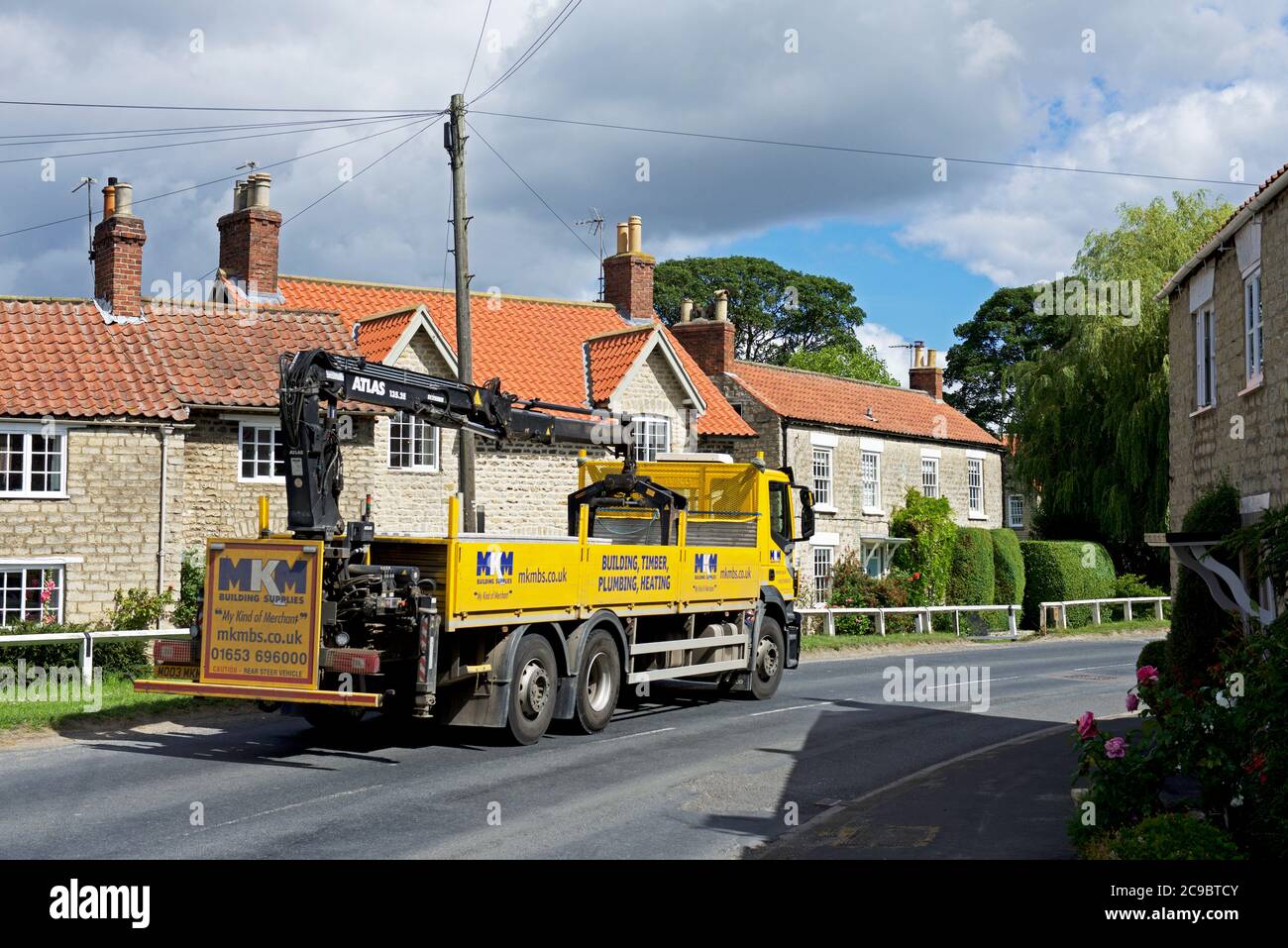 Builders' merchant lorry in the village of Hovingham, Ryedale, North ...