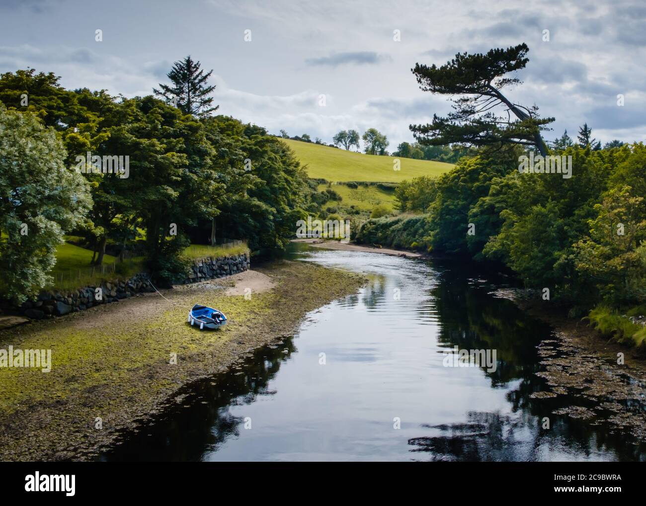 The scenic Glendun River flowing from the Glens of Antrim to the sea at ...