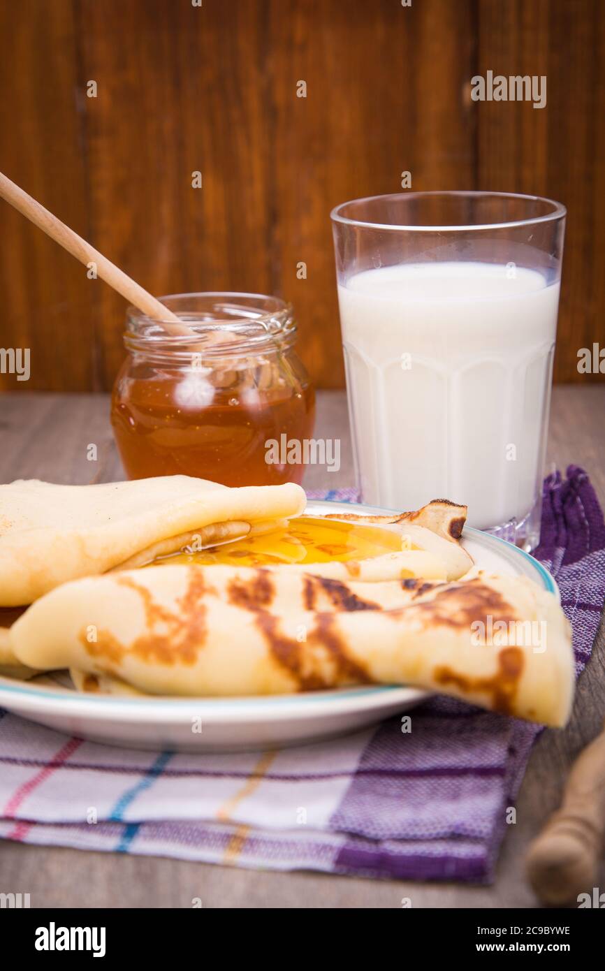 fresh pankaces with honey and milk in studio Stock Photo - Alamy