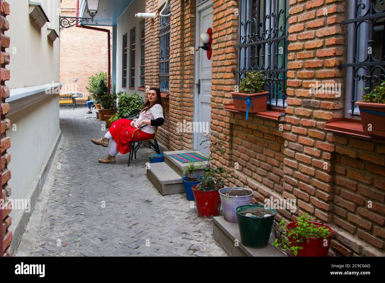 Young woman portrait, beautiful girl, pretty and cute. Sitting scene ...