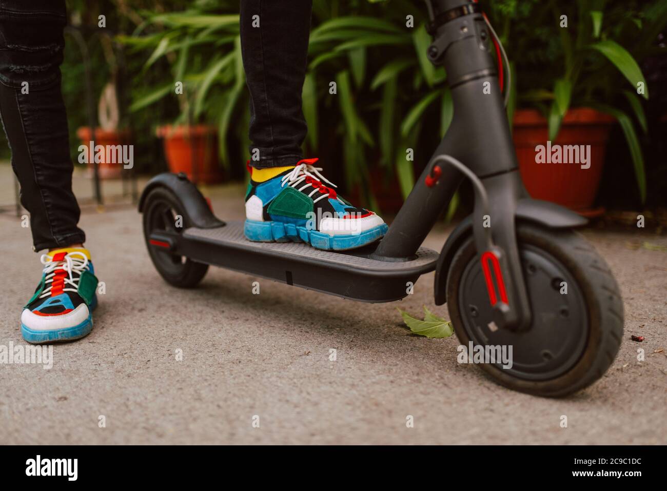 Business man riding scooter hi-res stock photography and images - Alamy