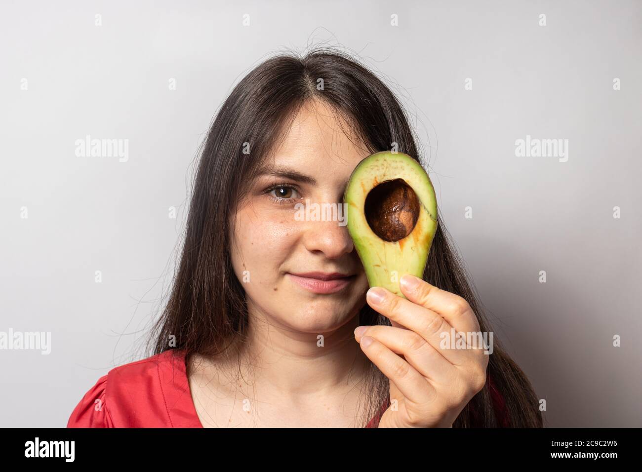 Girl with avocado. Proper nutrition, raw food diet and diet. Weight ...