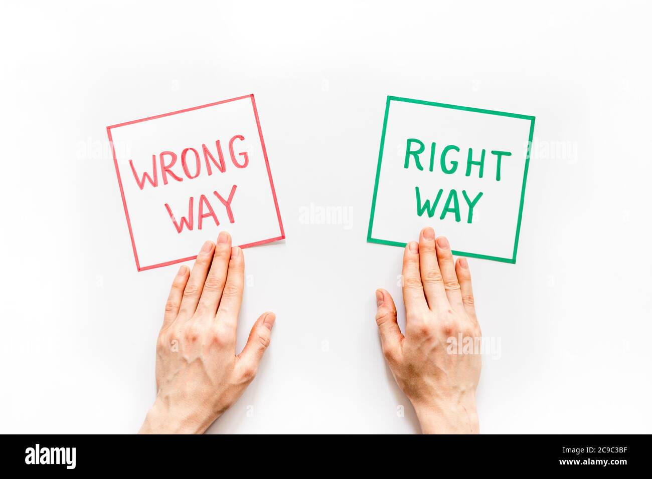 Choice concept. Right and wrong way icons, female hands top view Stock ...