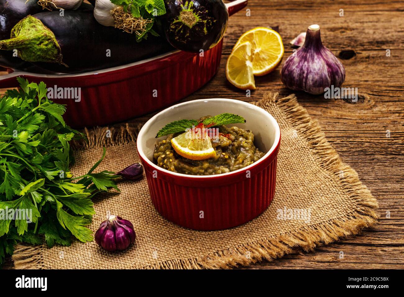 Eggplant dip baba ganoush (mutabbal) or mezze with ripe vegetables and ...