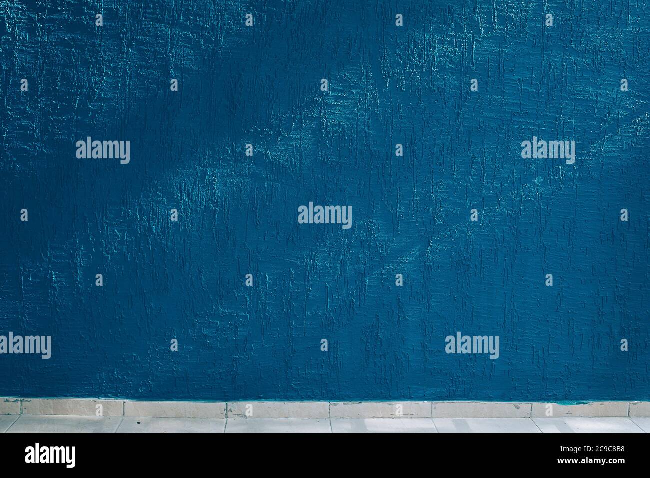 Bright blue wall with shadow from trees Stock Photo - Alamy