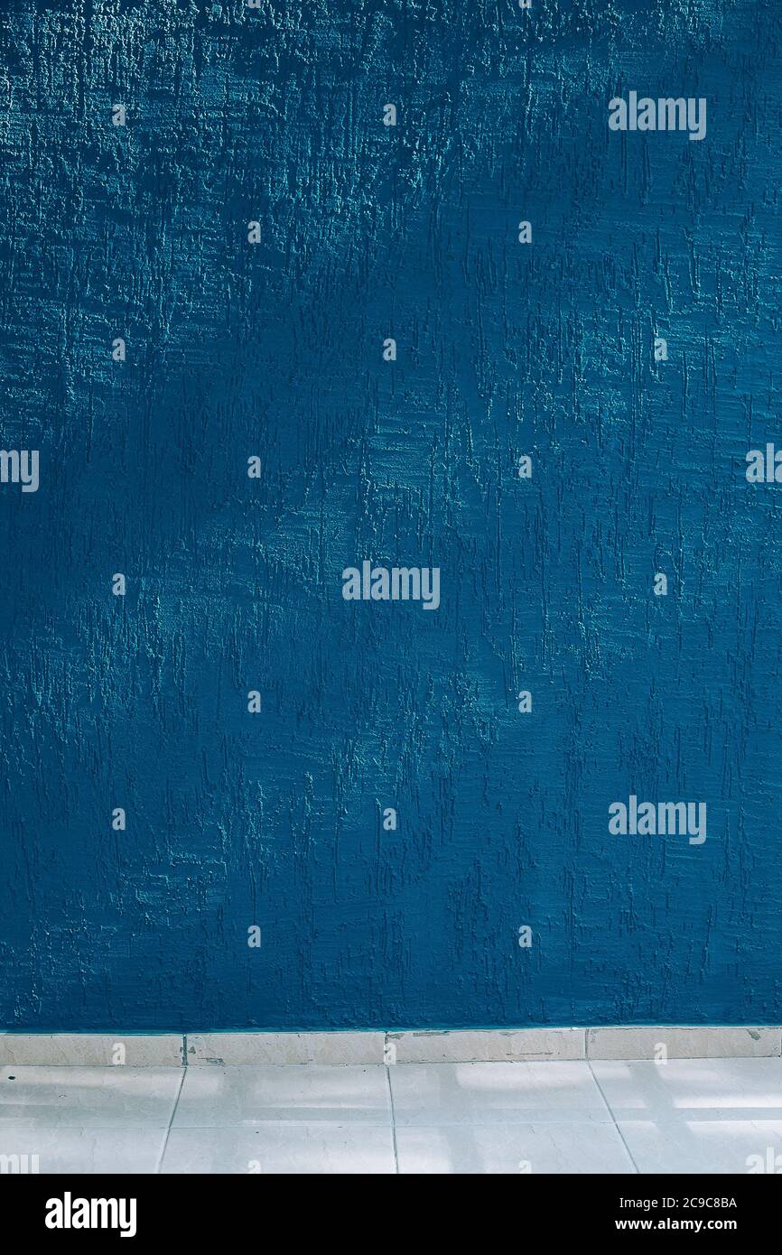 Bright blue wall with shadow from trees Stock Photo - Alamy