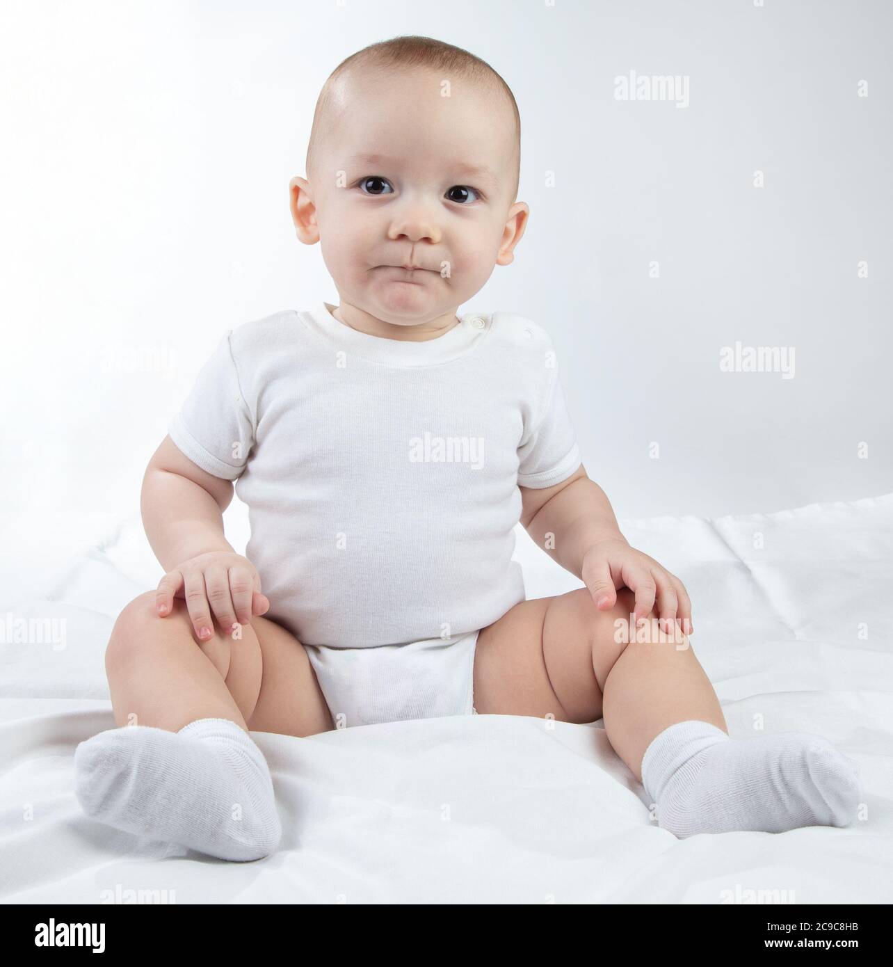 Photo of a pursing lips nine-month-old baby Stock Photo - Alamy