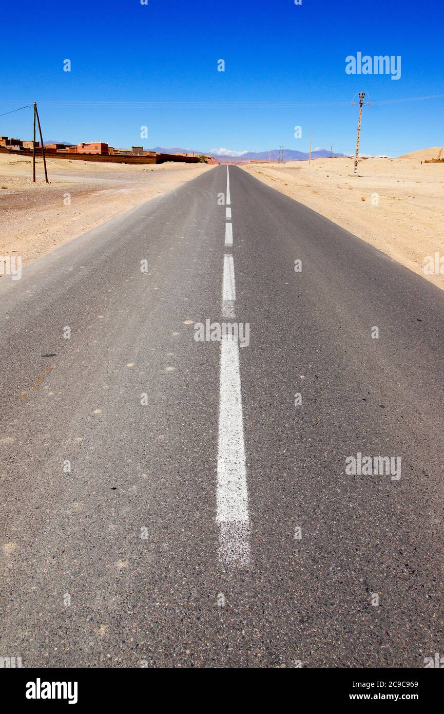 Empty straight road through the desert Stock Photo - Alamy