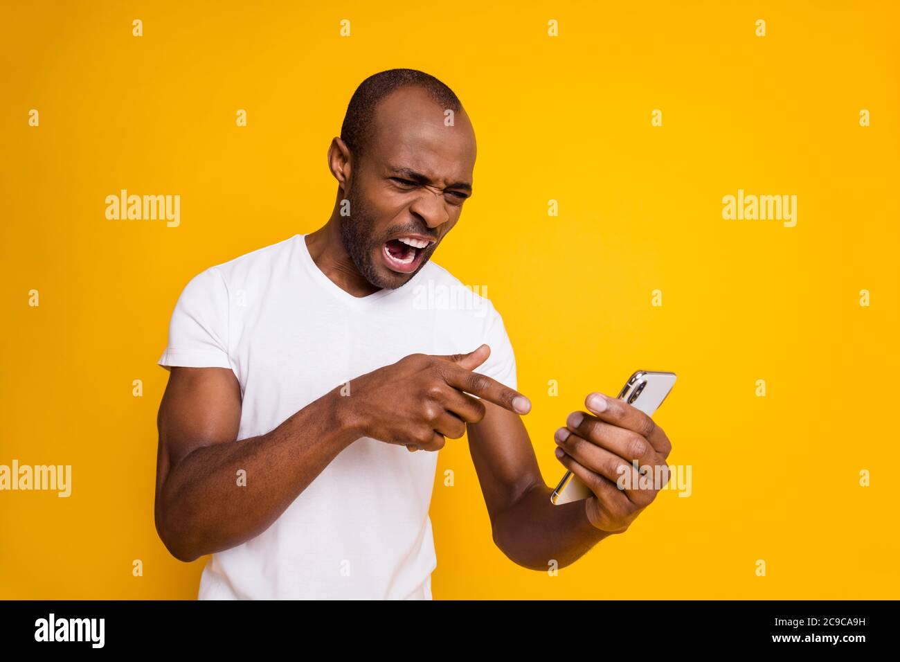 Frustrated furious upset guy use smartphone see his followers ...