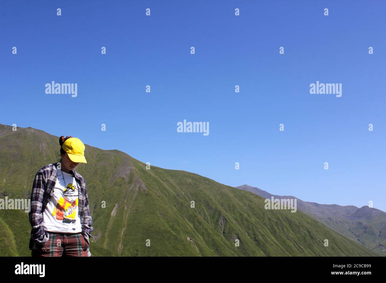 Hiker on the mountain landscape background, young girl backpacker in ...
