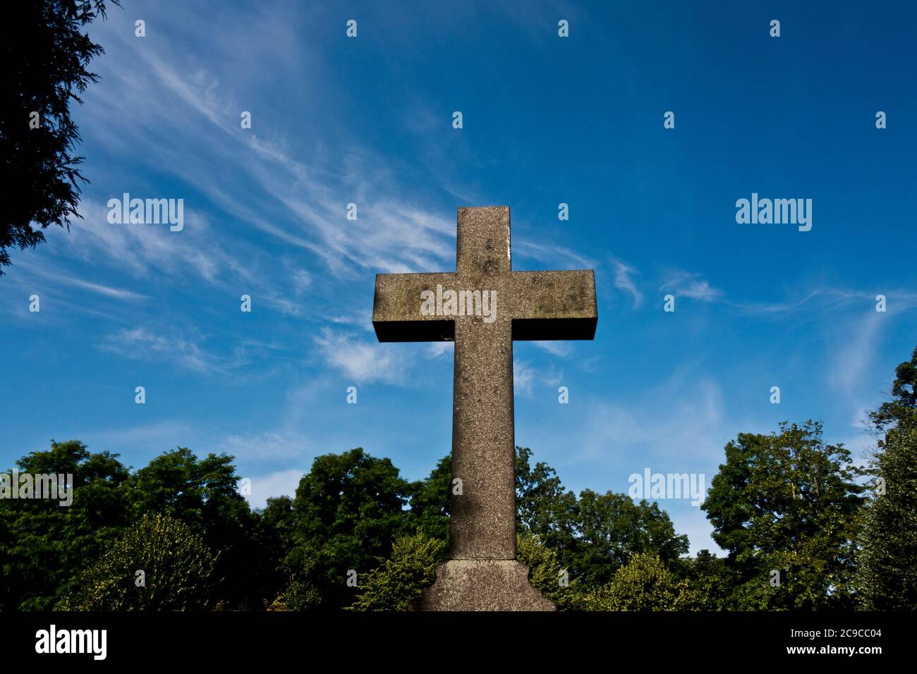 Grave stone and cross in cemetery hi-res stock photography and images ...