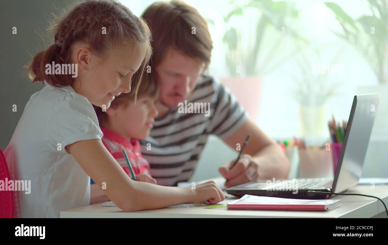 Cute children use laptop for education, online study, home studying ...