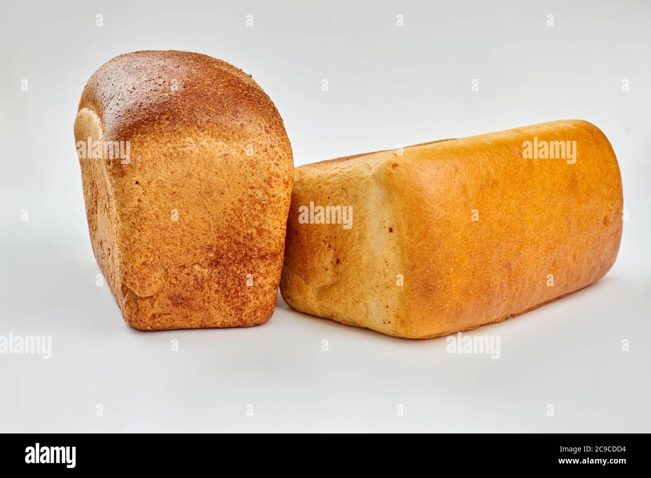 Two loaves of bread on white background Stock Photo - Alamy