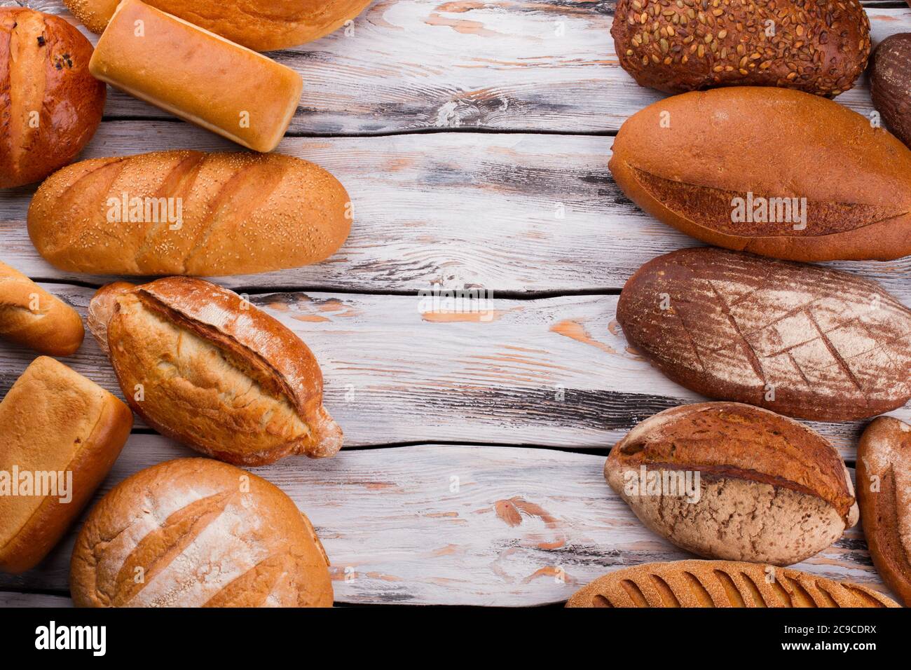 Bread frame on rustic wood background Stock Photo - Alamy