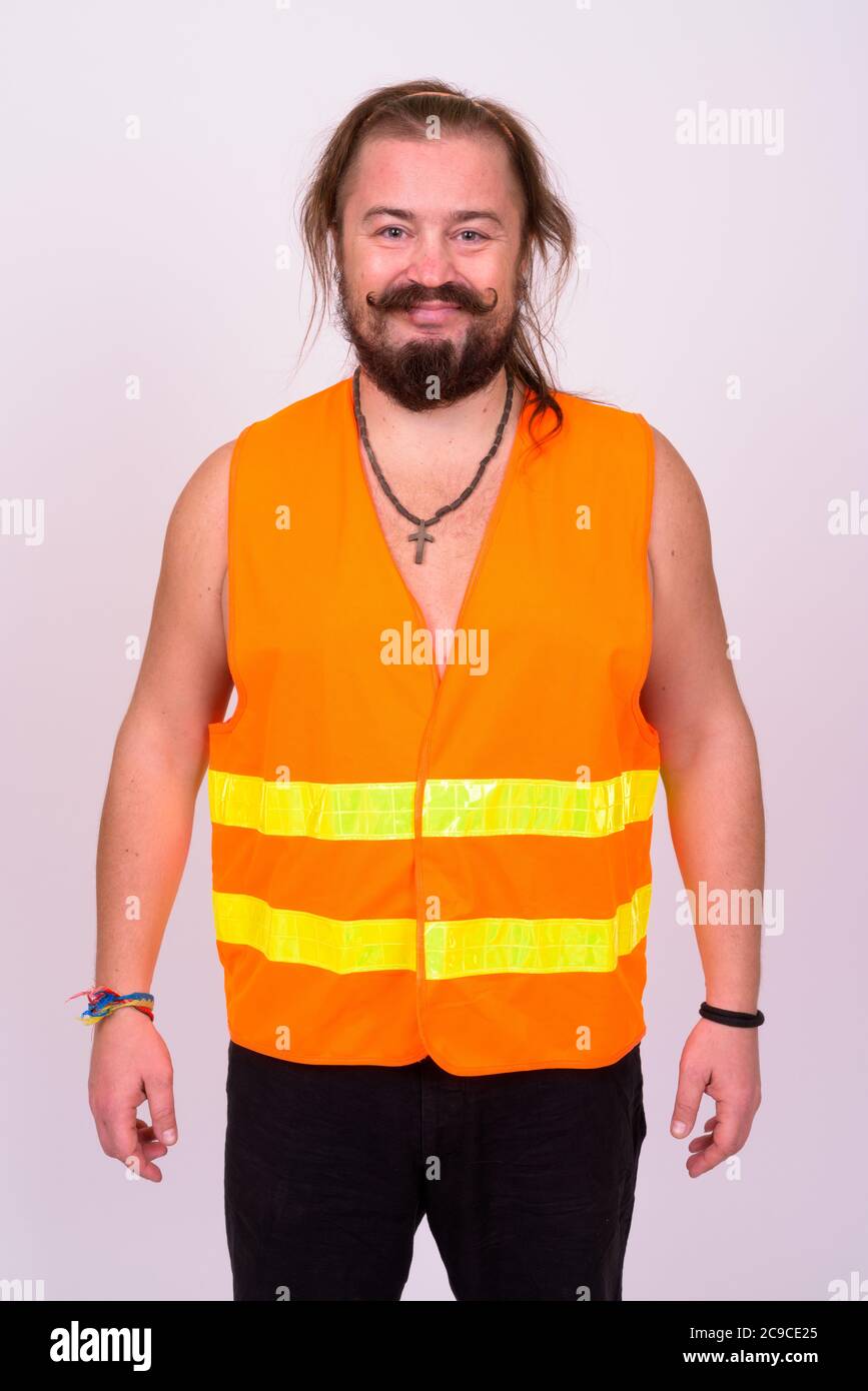 Portrait of happy bearded man construction worker with mustache and ...