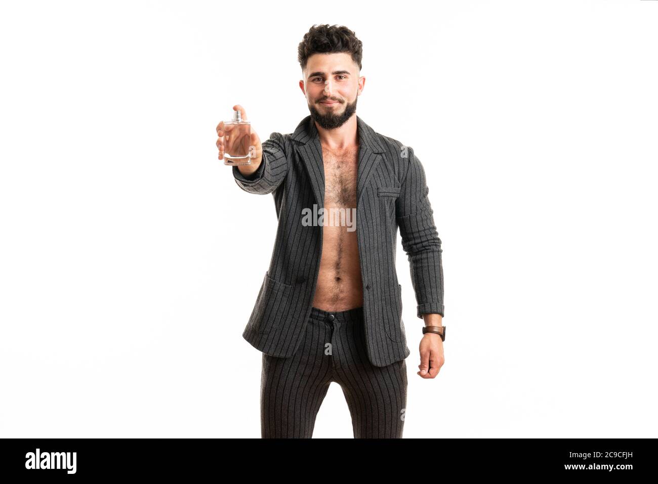 Bearded man holding perfume hi-res stock photography and images - Alamy