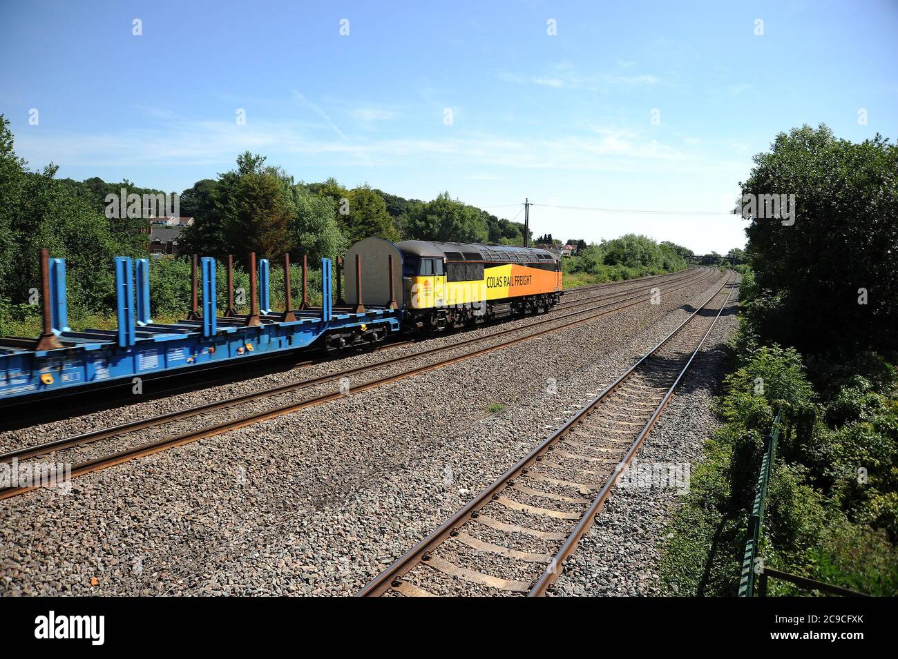 56302 hauls a Chirk - Teigngrace train of empty log carriers through ...