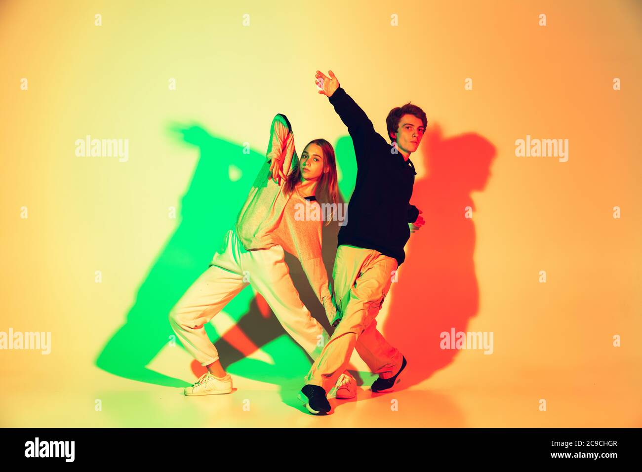 Young man and woman, couple dancing hip-hop, street style isolated on ...