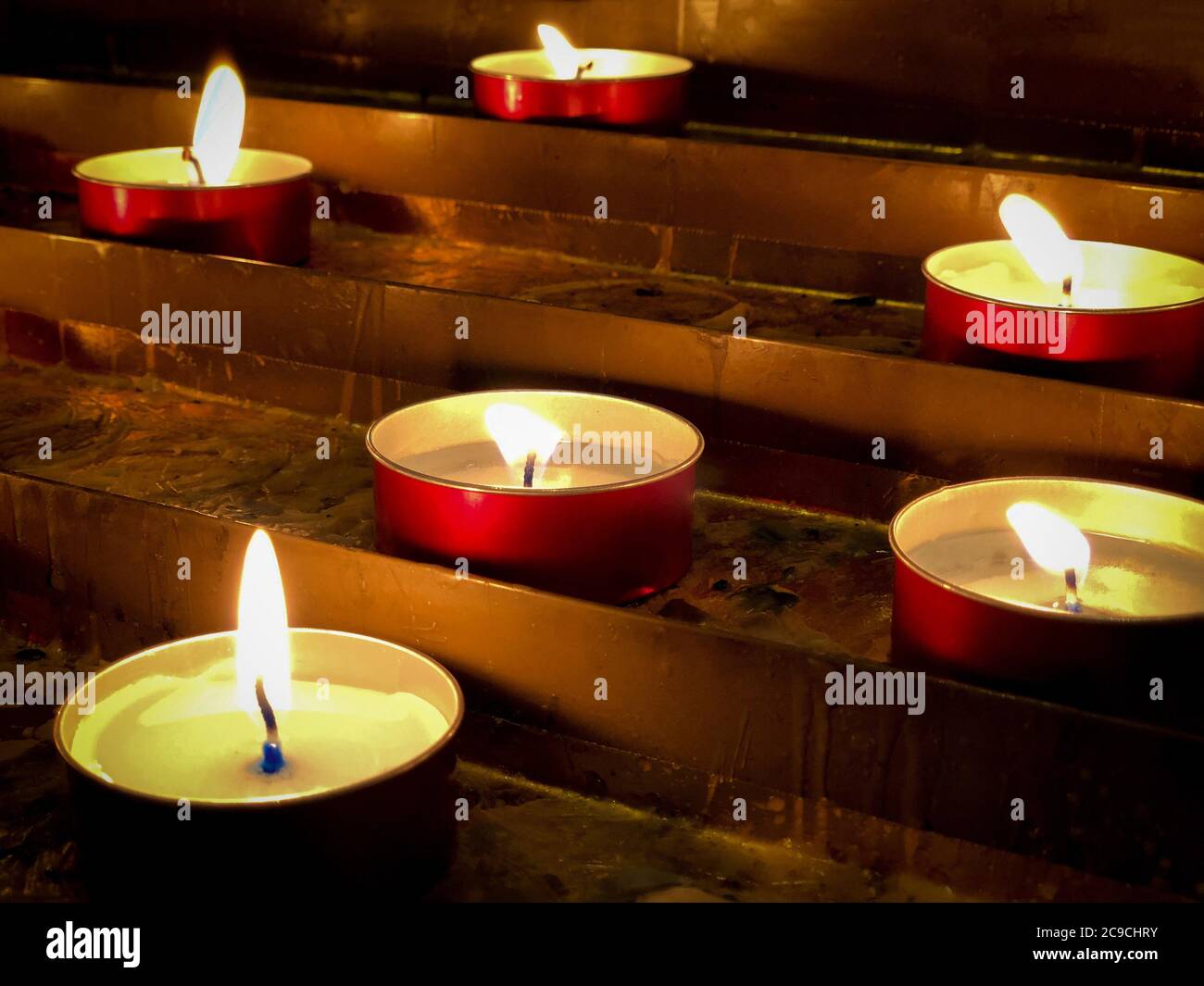 burning candle lights in a temple to make wish Stock Photo - Alamy
