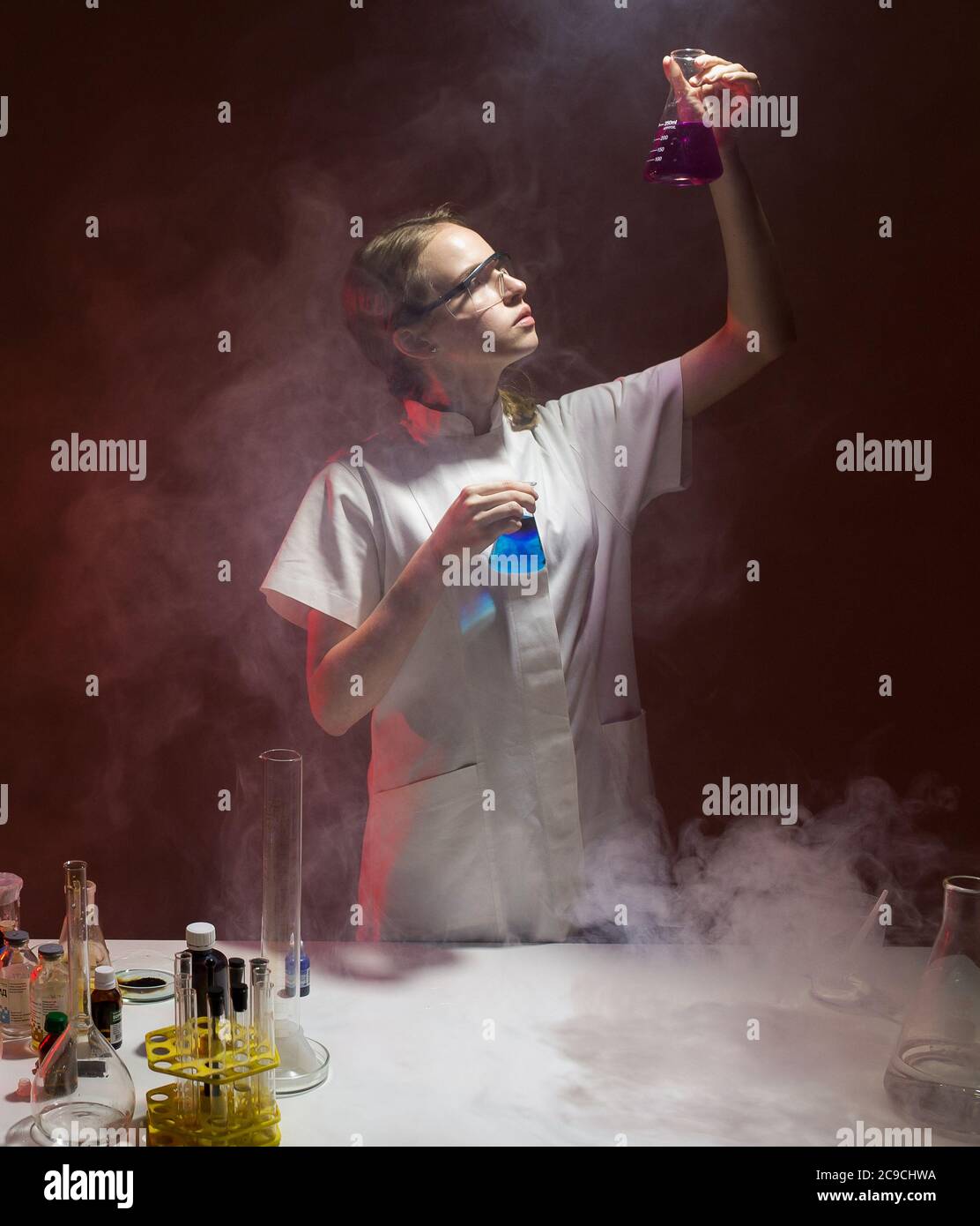 girl chemist in the laboratory conducts an experiment Stock Photo - Alamy