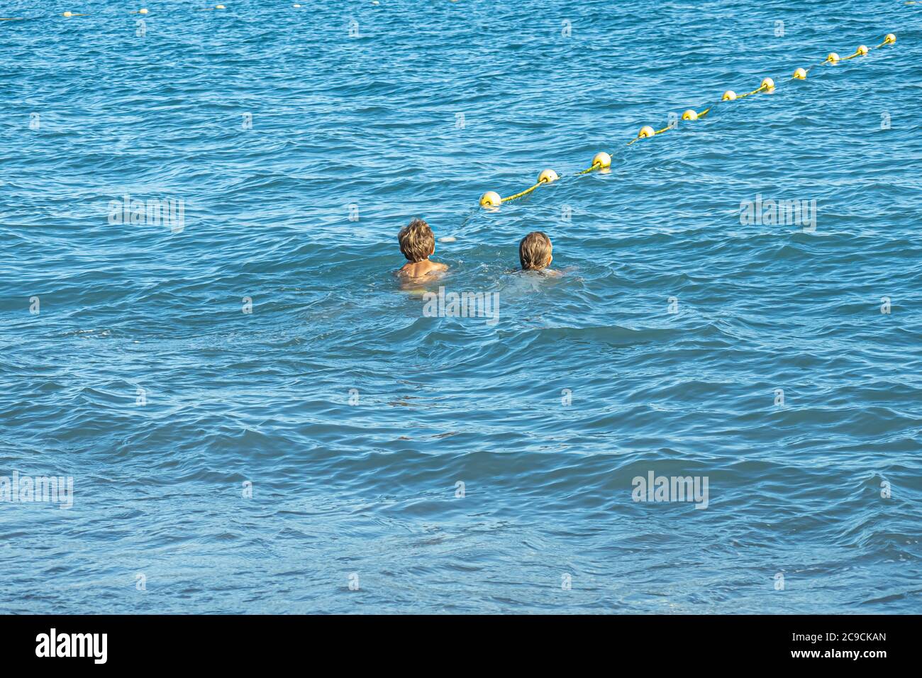 Brother and sister swimming together hi-res stock photography and ...
