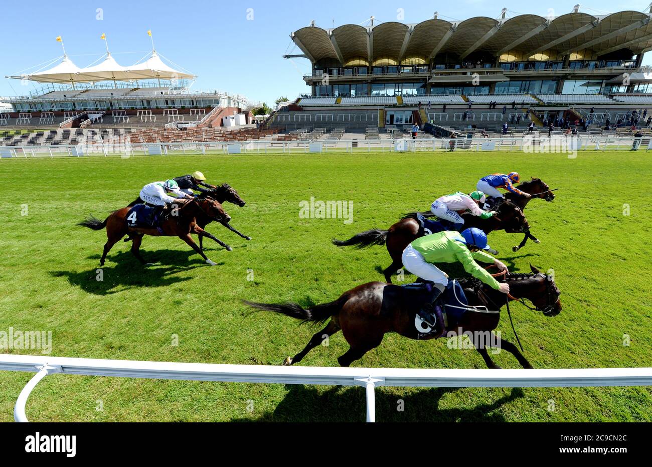 Mogul ridden by jockey Ryan Moore (far right) on their way to win the ...