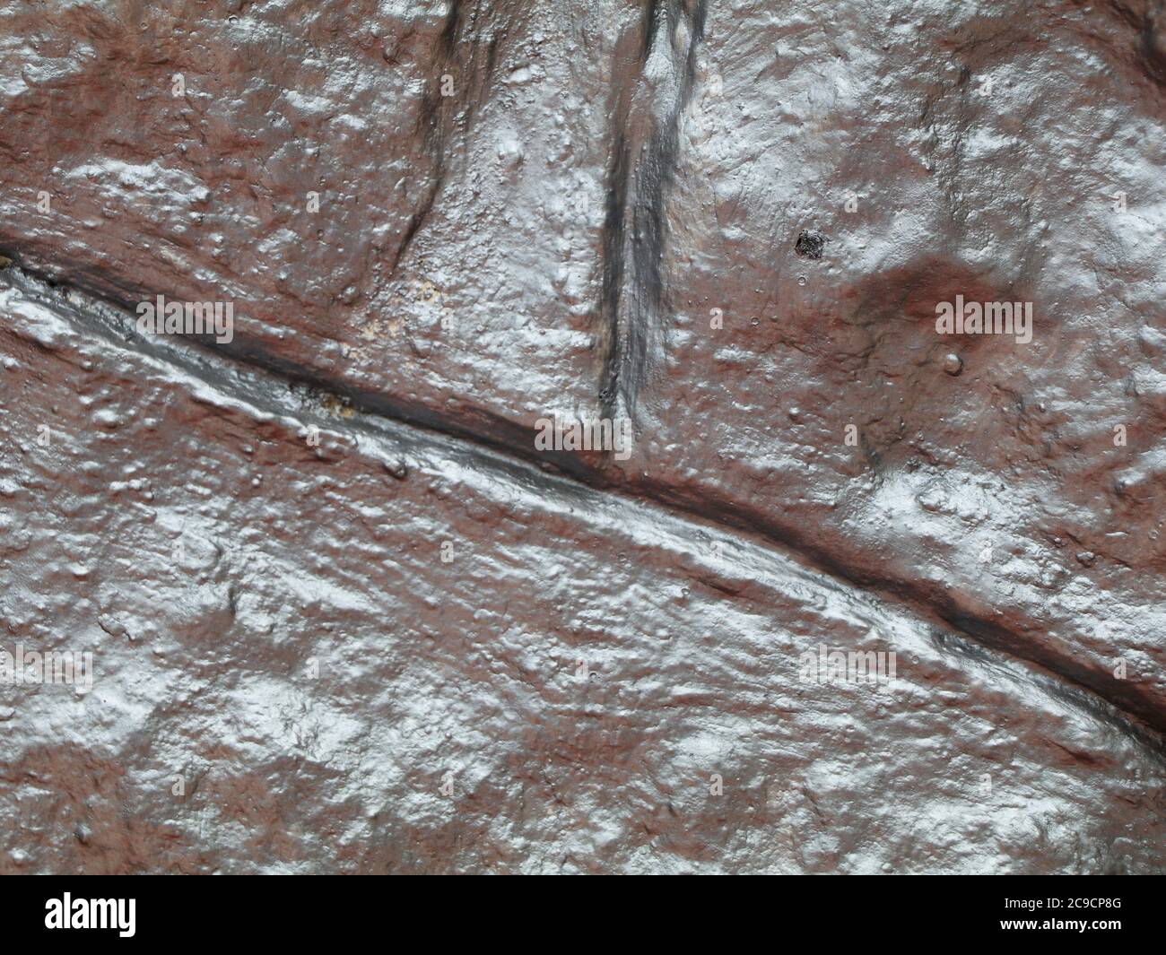 Old stone wall with metallic silver paint as texture, background Stock ...