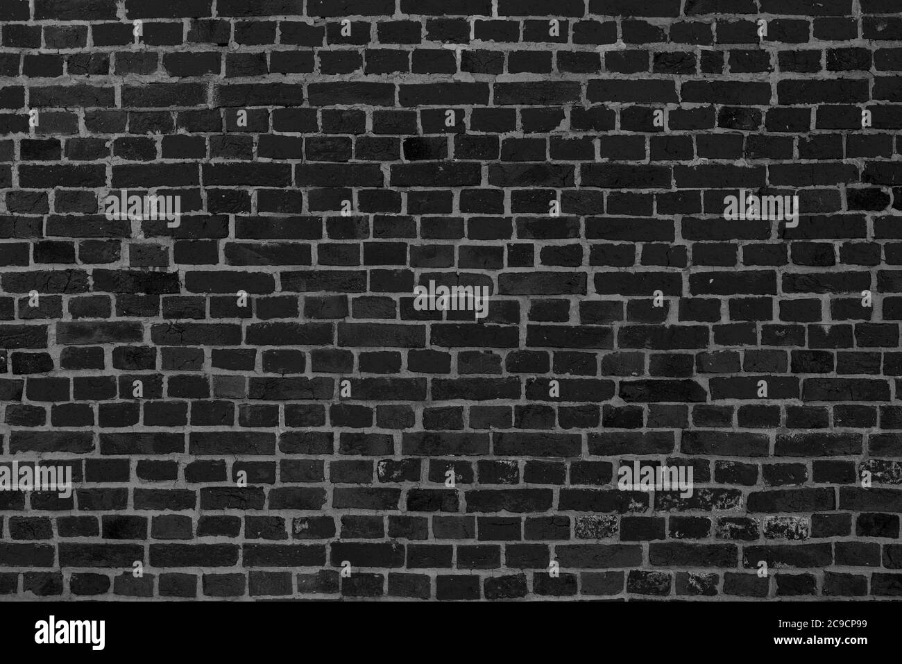 The background of the old black brick wall for design interior and ...