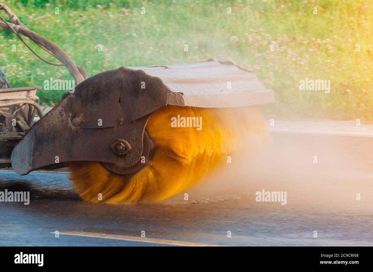 Brush on the sweeper rotates the streets cleaning asphalt Stock Photo ...