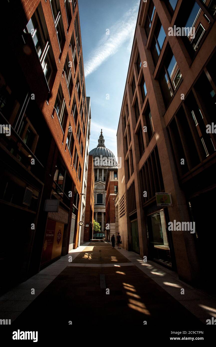 St Pauls seen through alley of red brick shops Stock Photo - Alamy