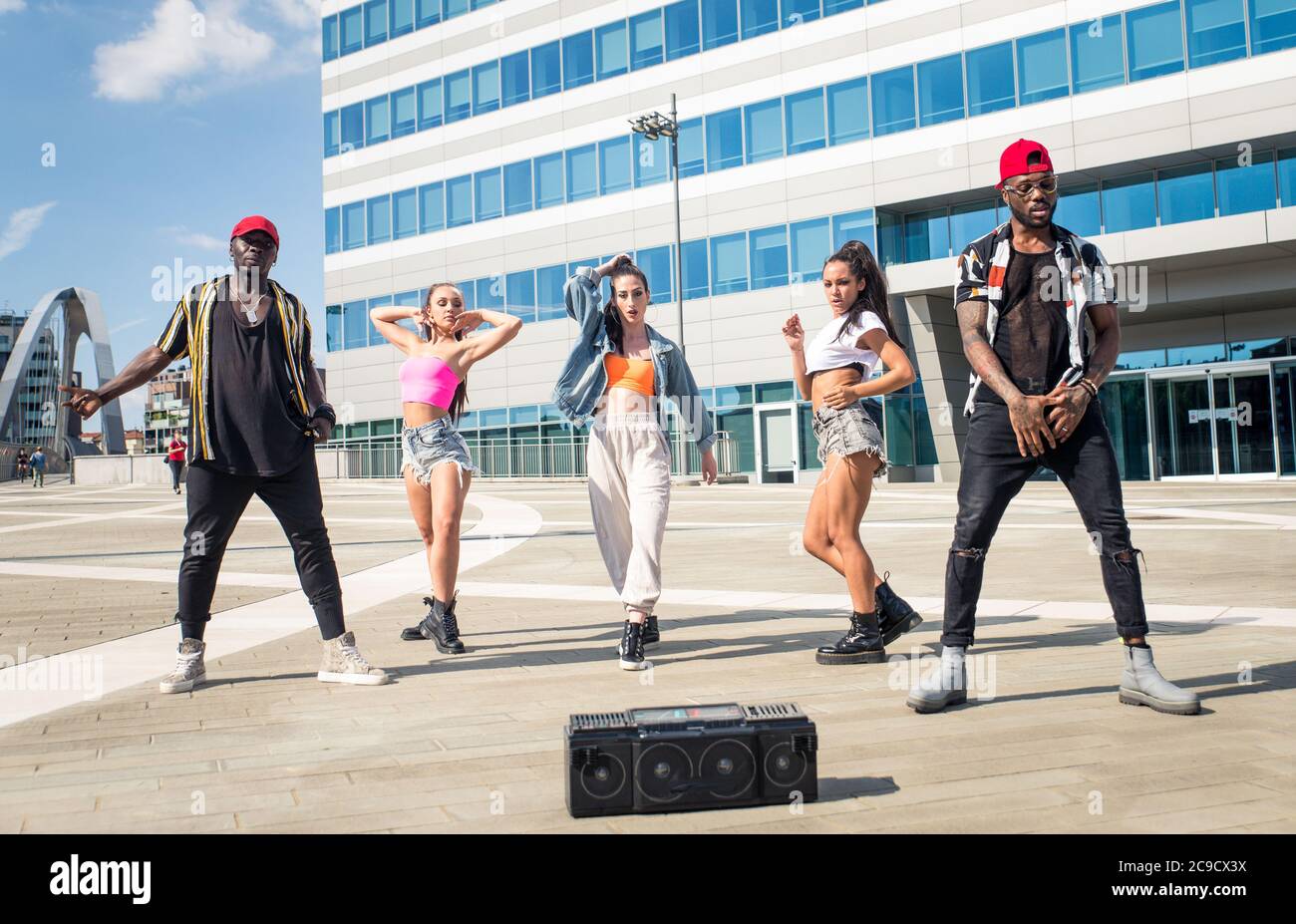 Group of hip hop dancers permorming their dance. Crew making show in an ...